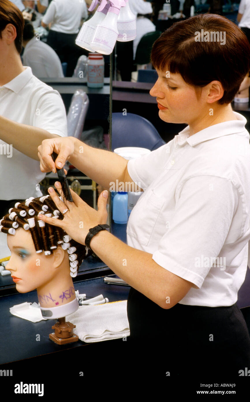 College student working on hair and cosmetology with teachers and ...