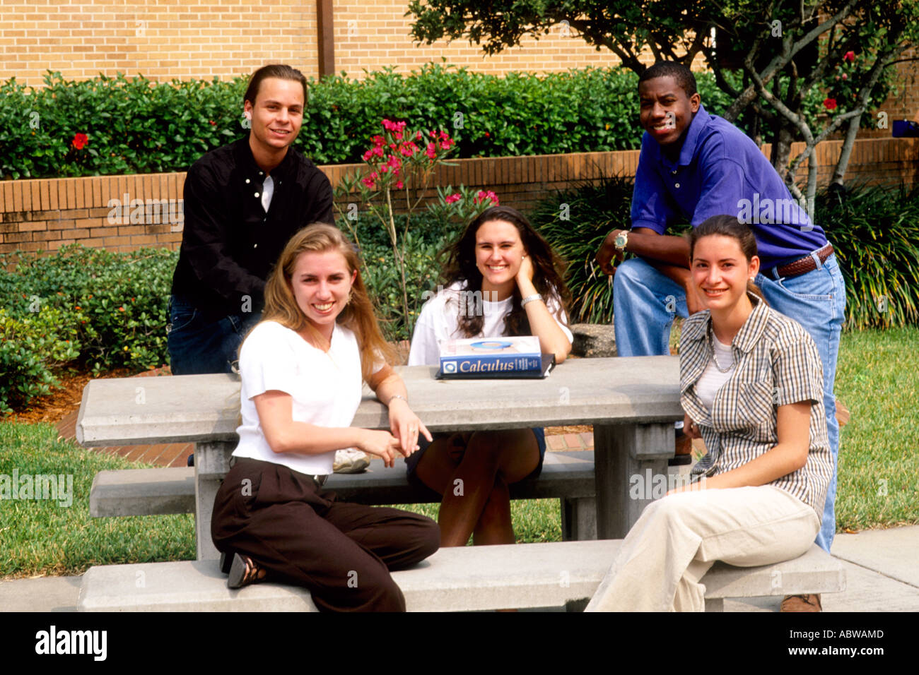 College students outside relaxing before going to class Stock Photo - Alamy
