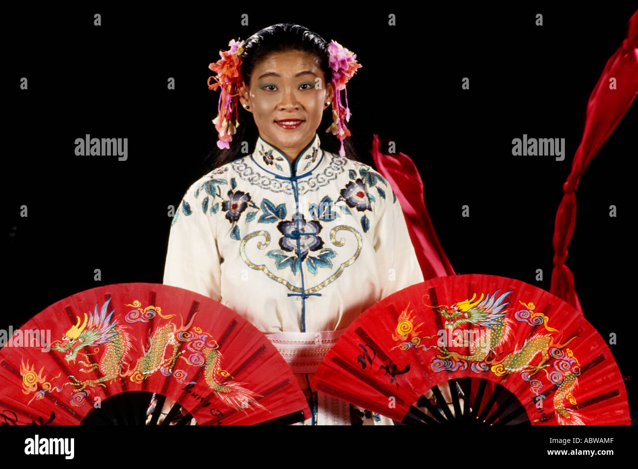 Chinese dancer in Hong Kong doing Red Flag Dance with color and fans ...