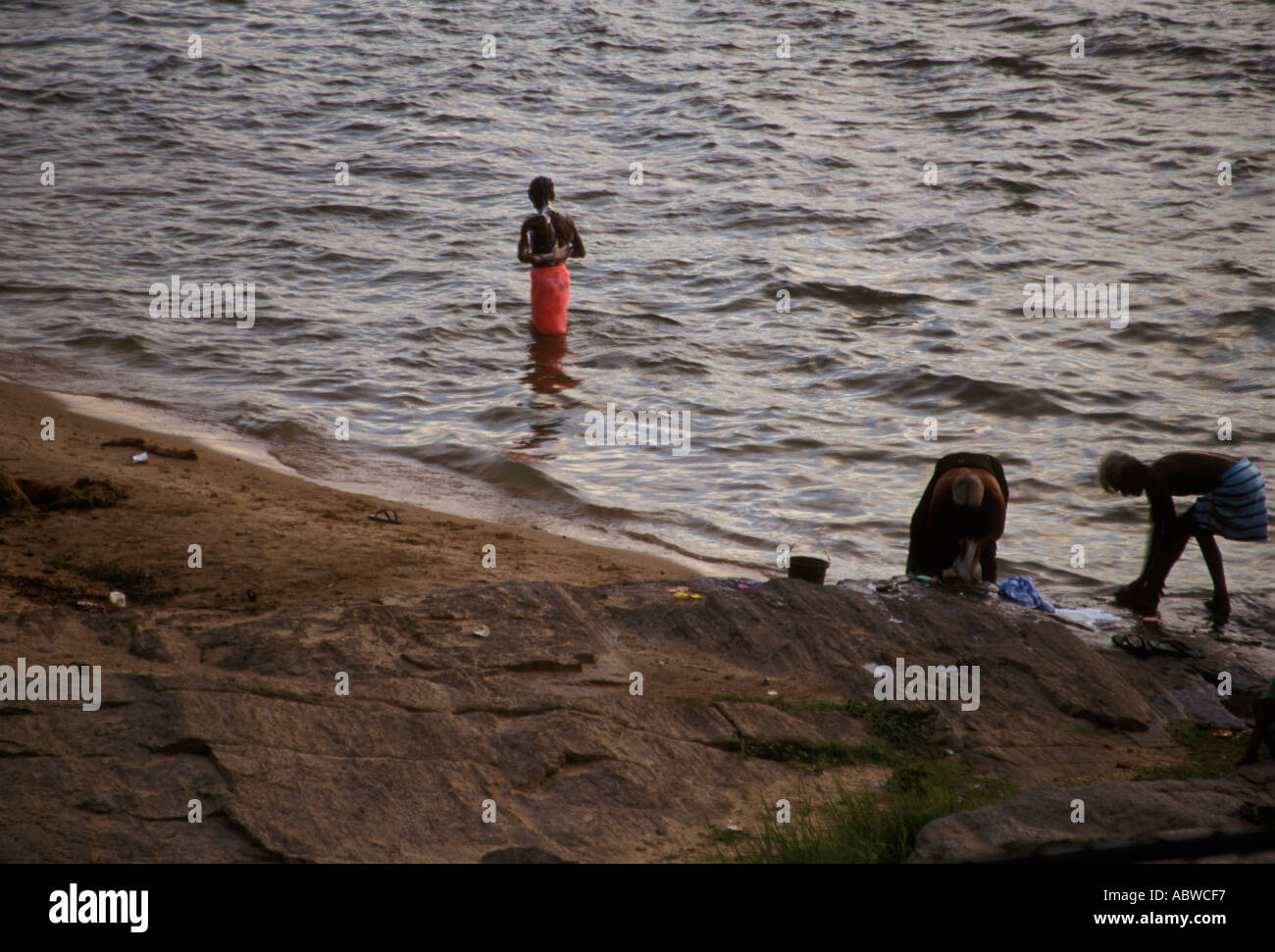 Men bathing in the tank in Polonaruwa in SRI LANKA at dusk Stock Photo ...