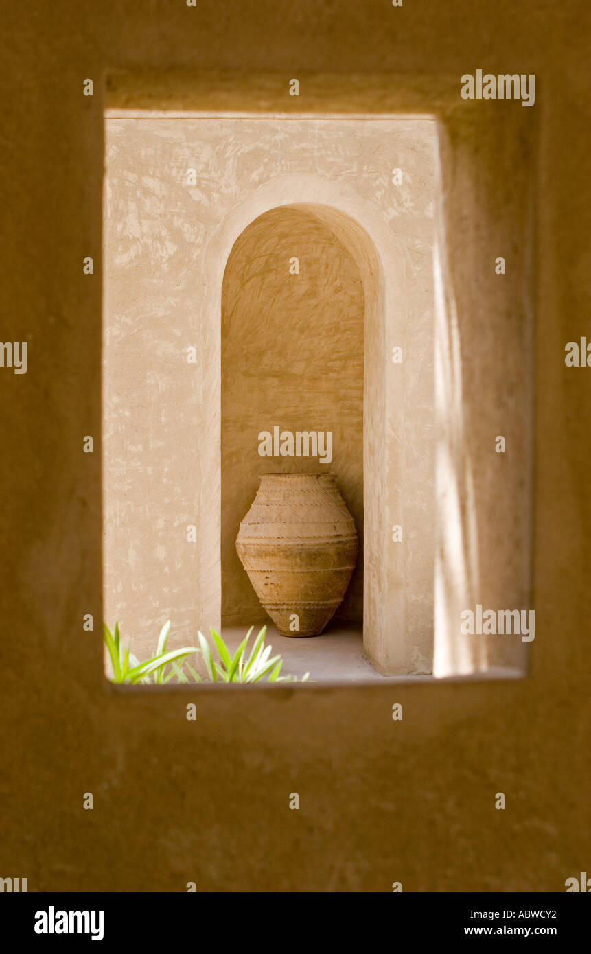 Pottery pot through window aperture Stock Photo - Alamy