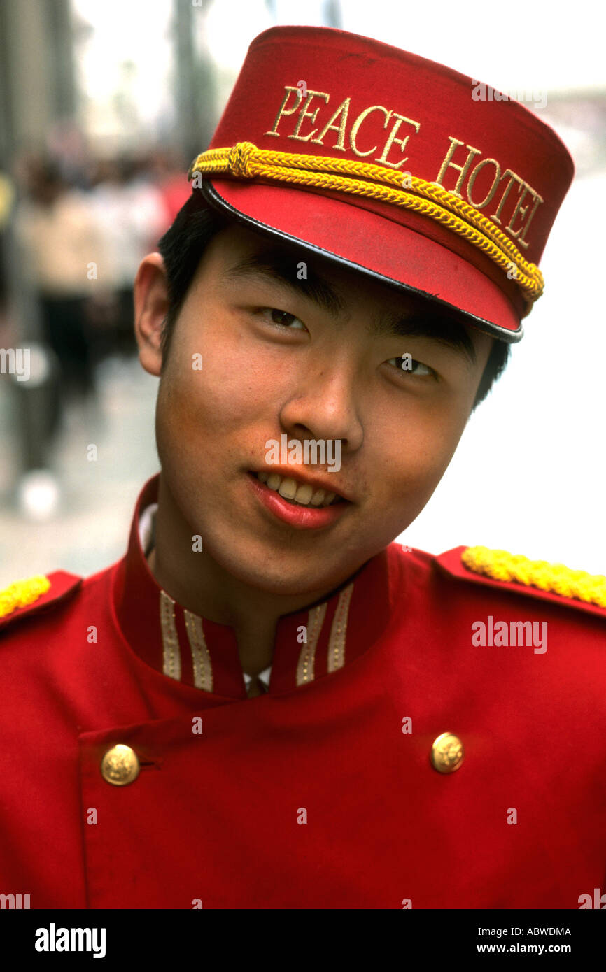 Bellhop bellman at the famous Peace Hotel in Shanghai China Stock Photo ...