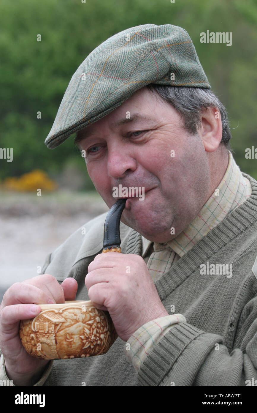 "Fisherman jokes with a pipe shaped ashtray Stock Photo - Alamy