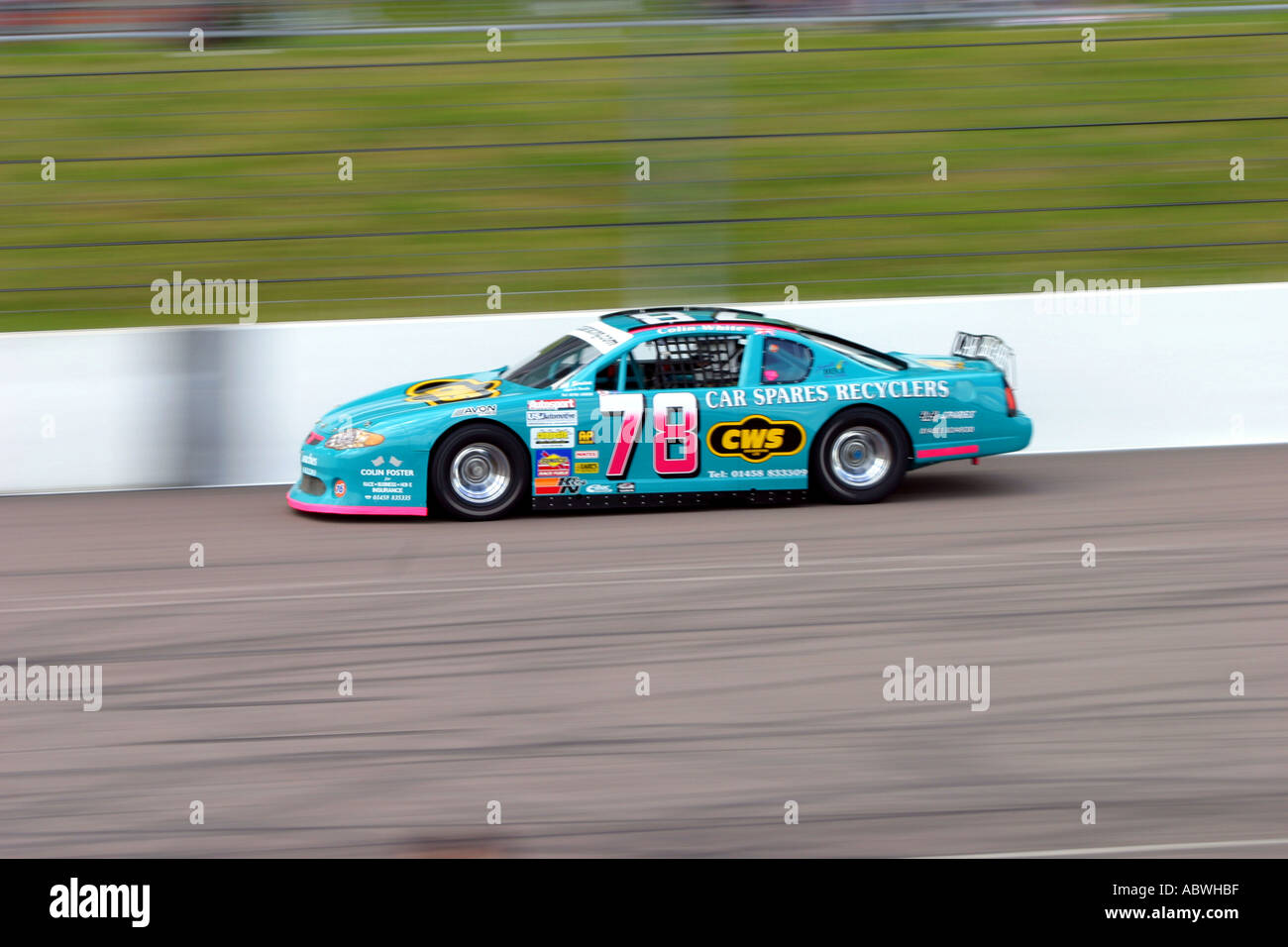 V8 Nascar type stock cars racing on a banked oval circuit Stock Photo ...