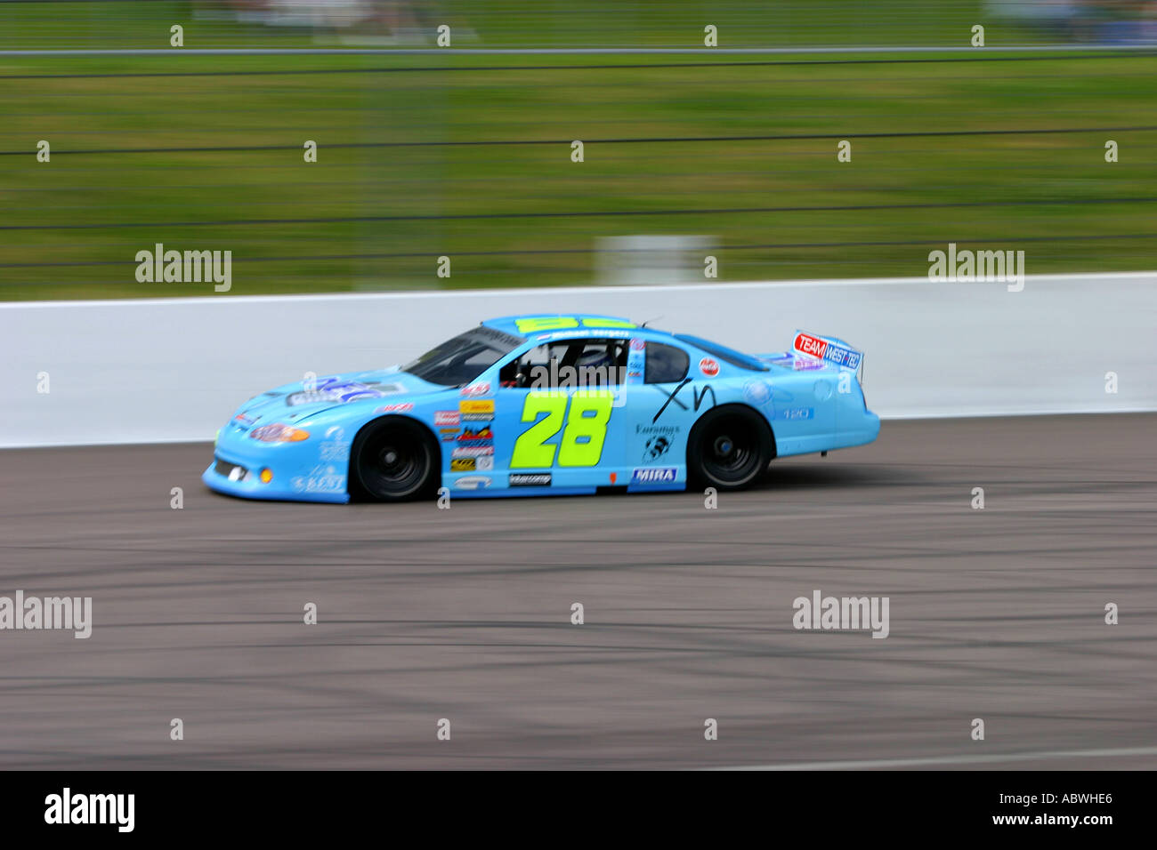 V8 Nascar type stock cars racing on a banked oval circuit Stock Photo ...