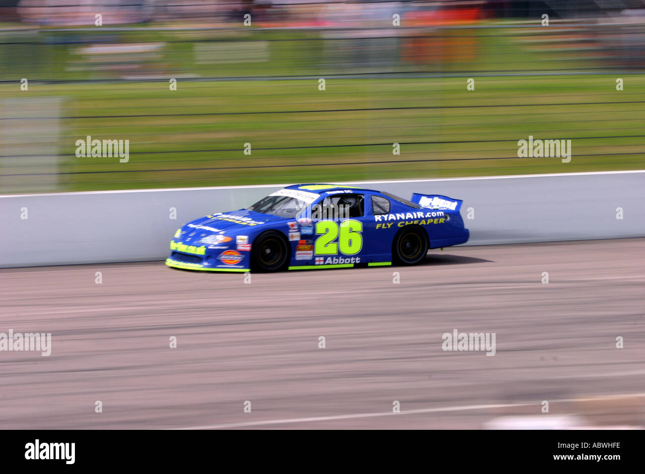 V8 Nascar type stock cars racing on a banked oval circuit Stock Photo ...