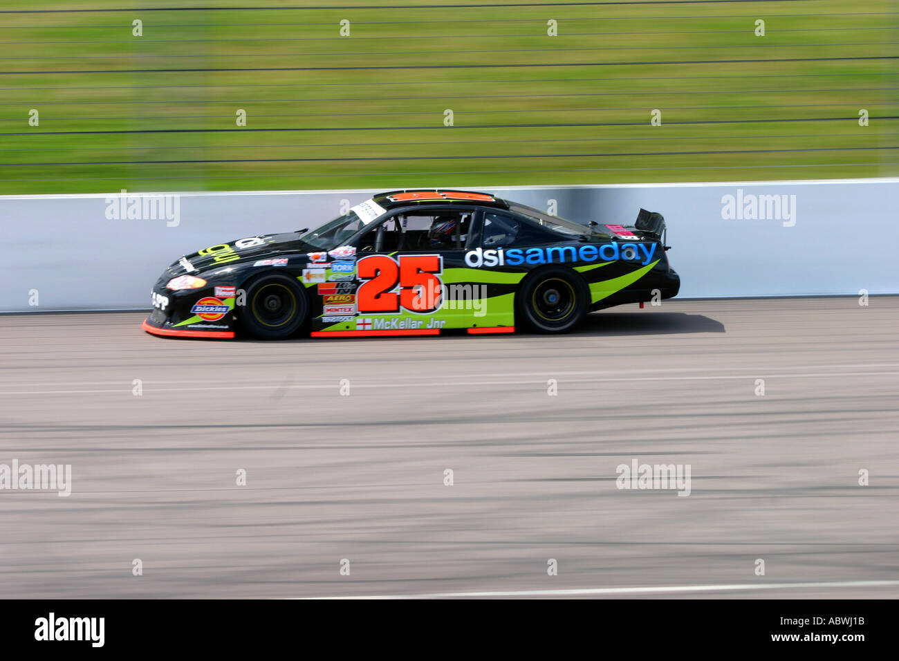 V8 Nascar type stock cars racing on a banked oval circuit Stock Photo ...