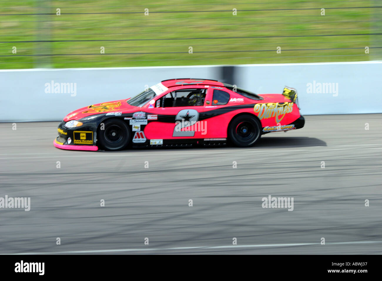 V8 Nascar type stock cars racing on a banked oval circuit Stock Photo ...