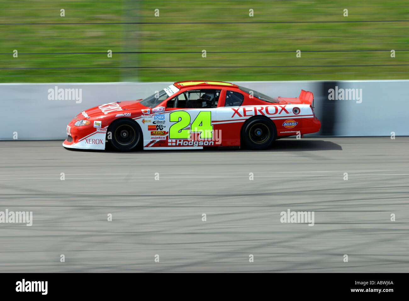 V8 Nascar type stock cars racing on a banked oval circuit Stock Photo ...