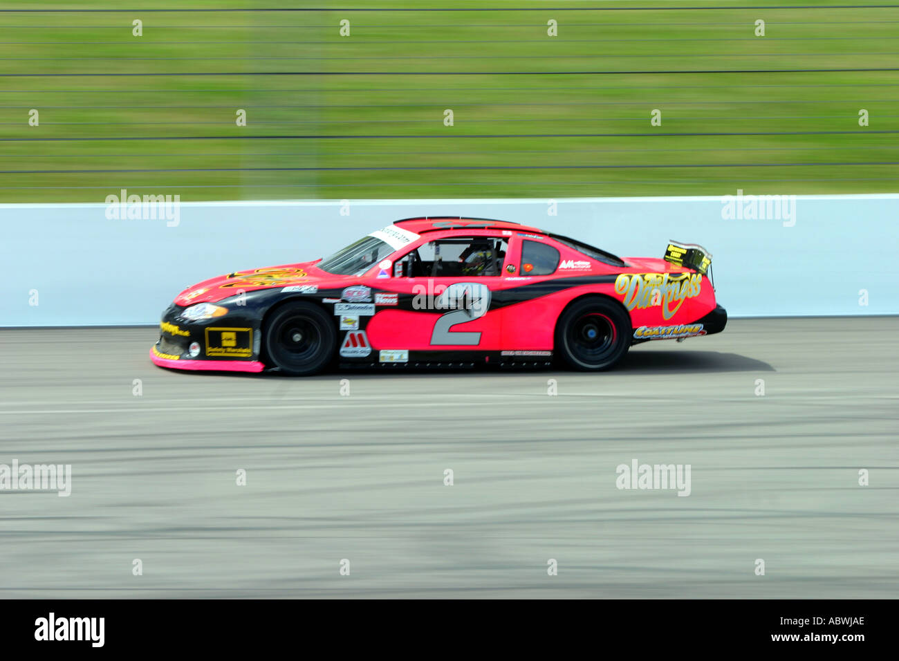 V8 Nascar type stock cars racing on a banked oval circuit Stock Photo ...