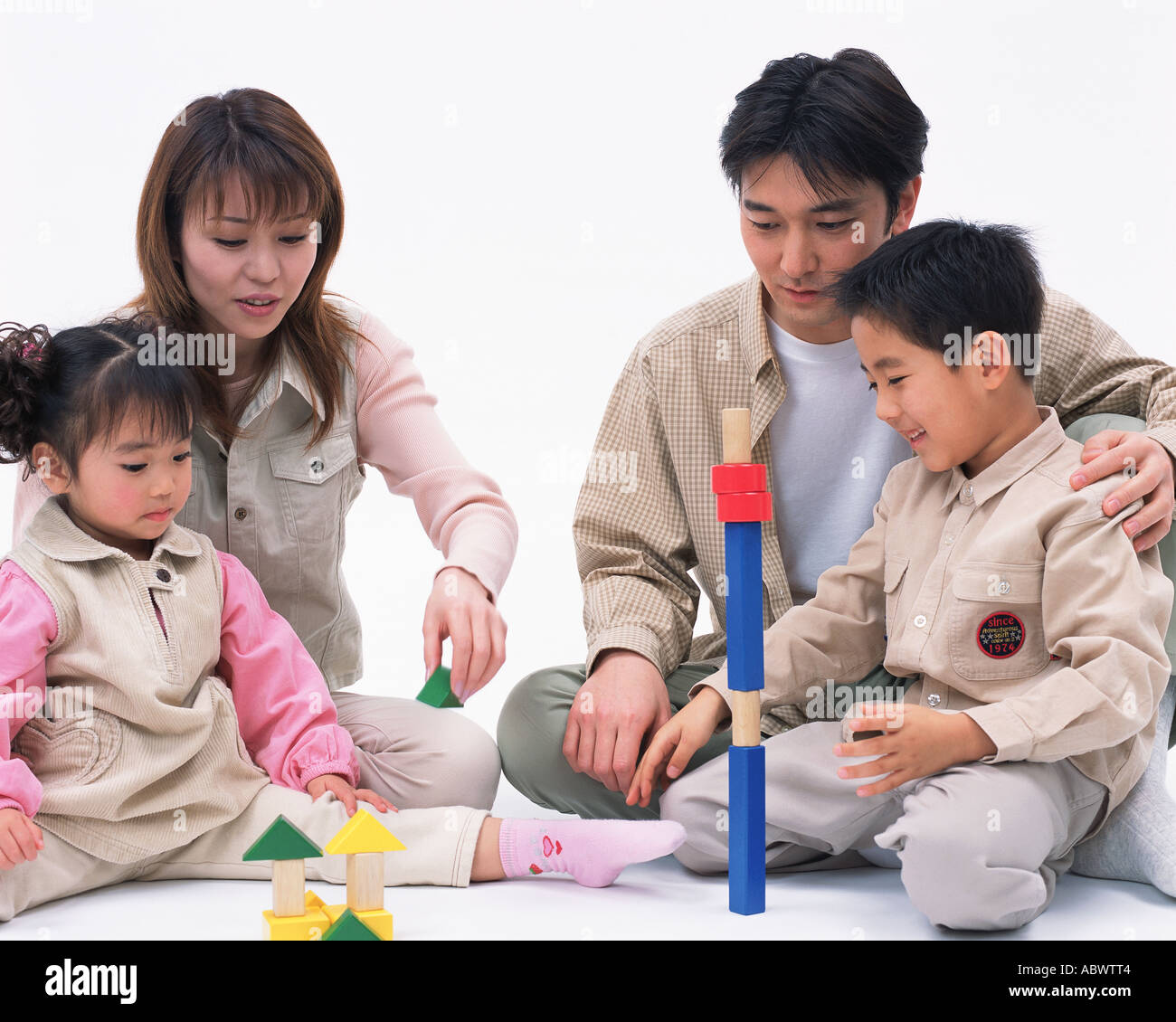 Parents playing with their children Stock Photo - Alamy