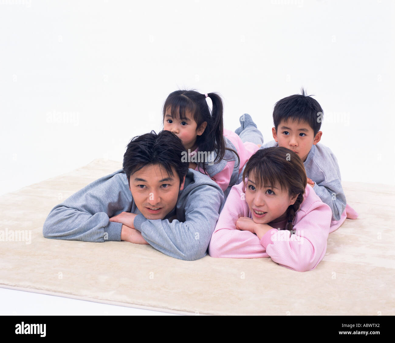 Two children resting on their parents back Stock Photo - Alamy
