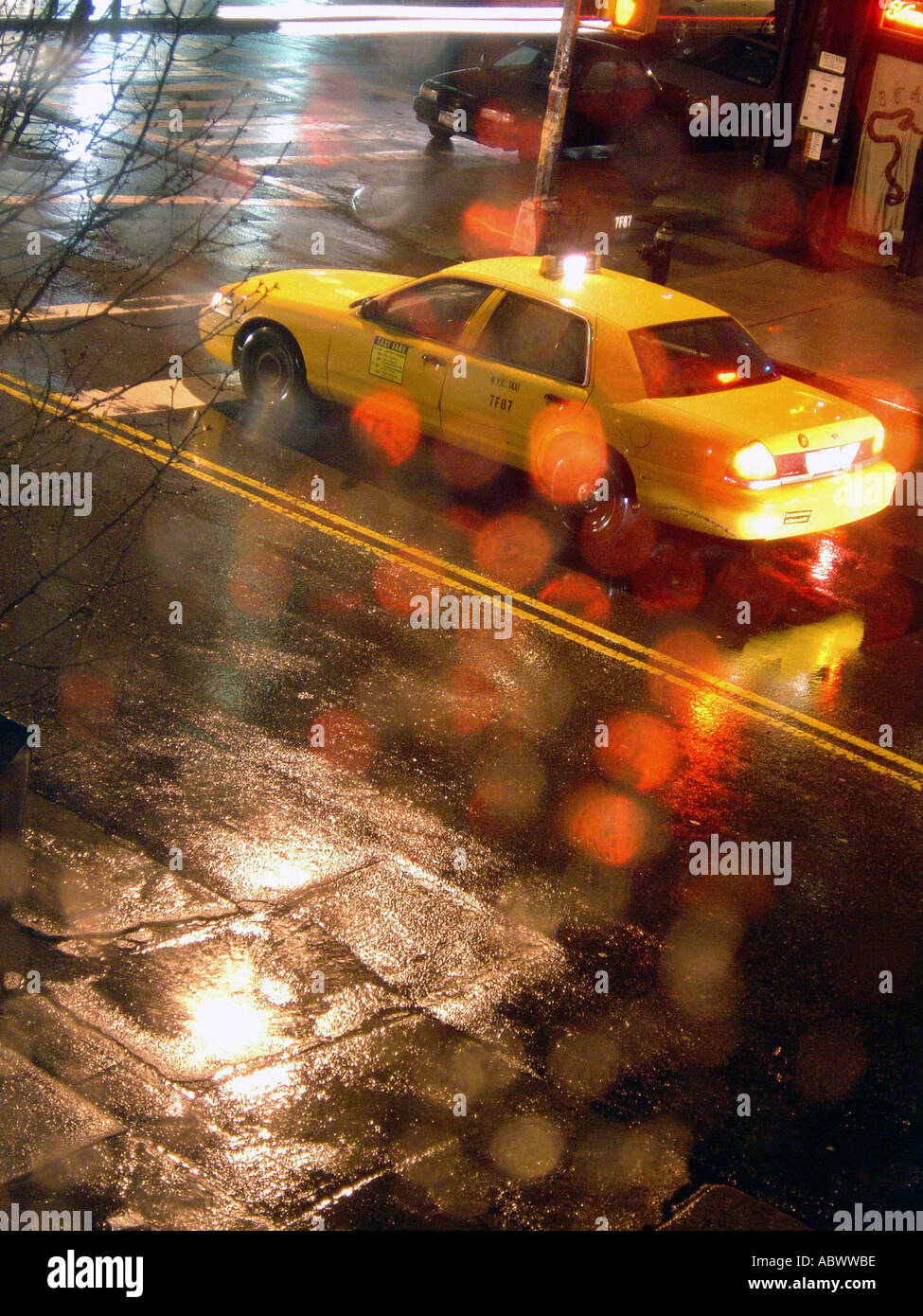 Urban Scene of a Yellow Taxi Cab Viewed Through A Window That is Wet ...