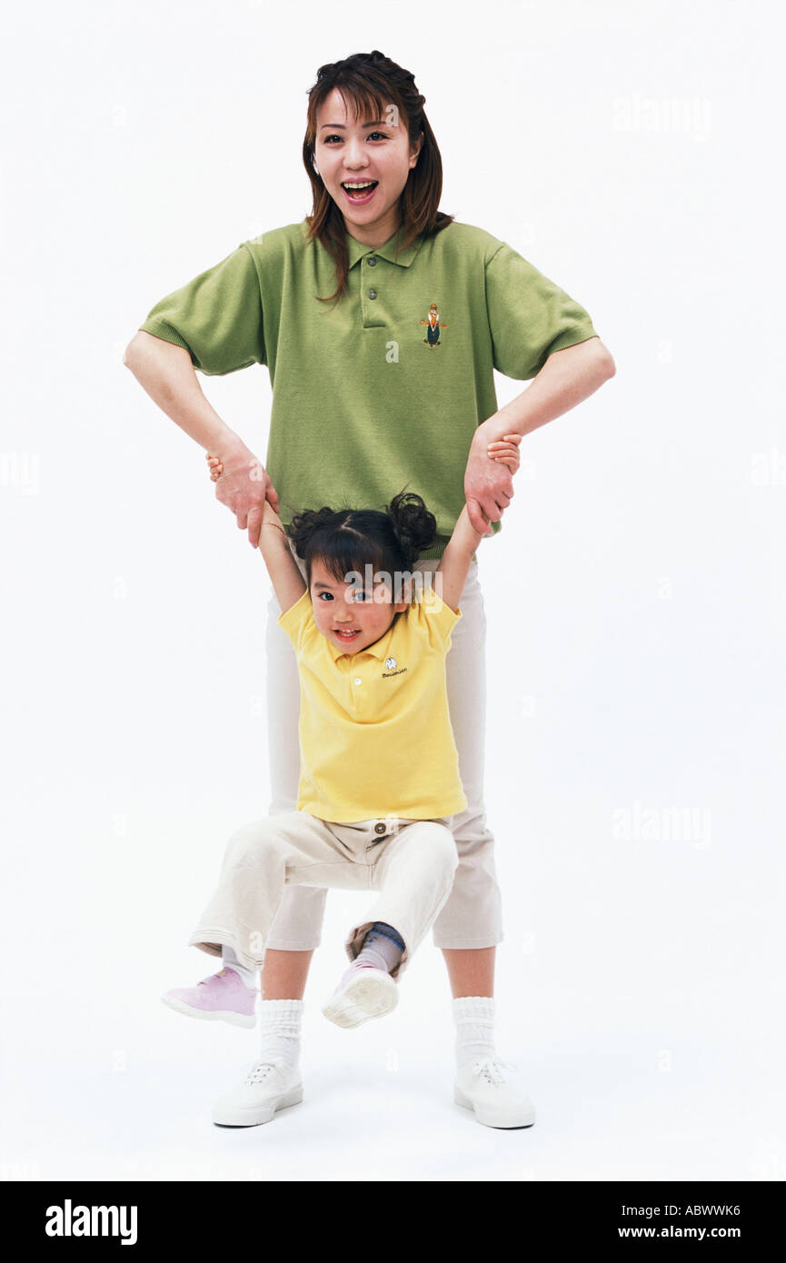 Kid lifting kid Cut Out Stock Images & Pictures - Alamy