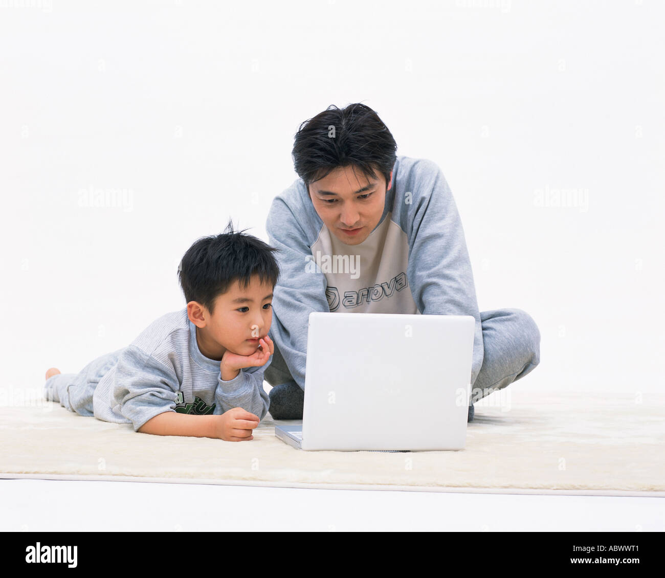 Two boys looking at computer Cut Out Stock Images & Pictures - Alamy
