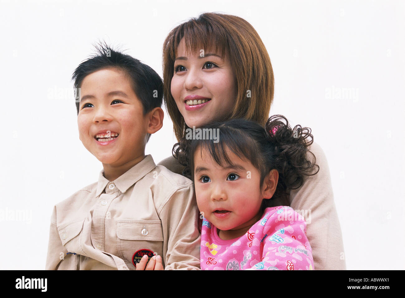 Portrait of a woman along with her two children Stock Photo - Alamy