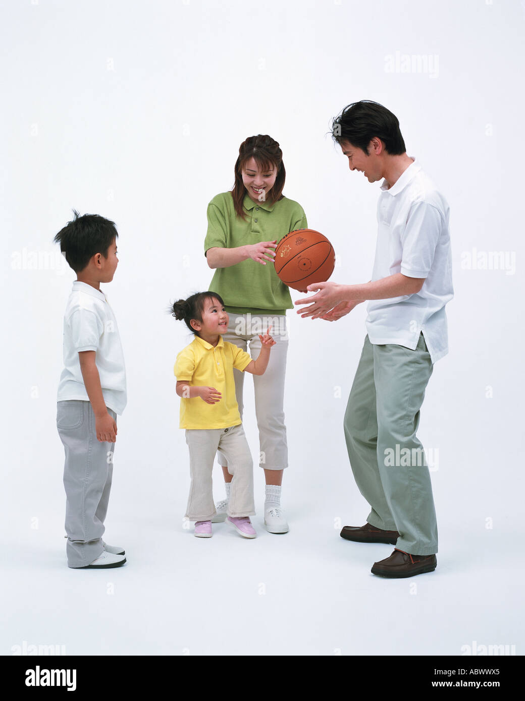 A family playing with a basketball Stock Photo - Alamy