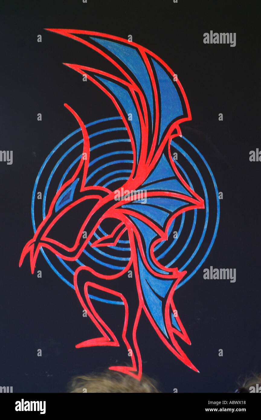 Psychedelic decoration dancing dragon at rave music outdoors party ...