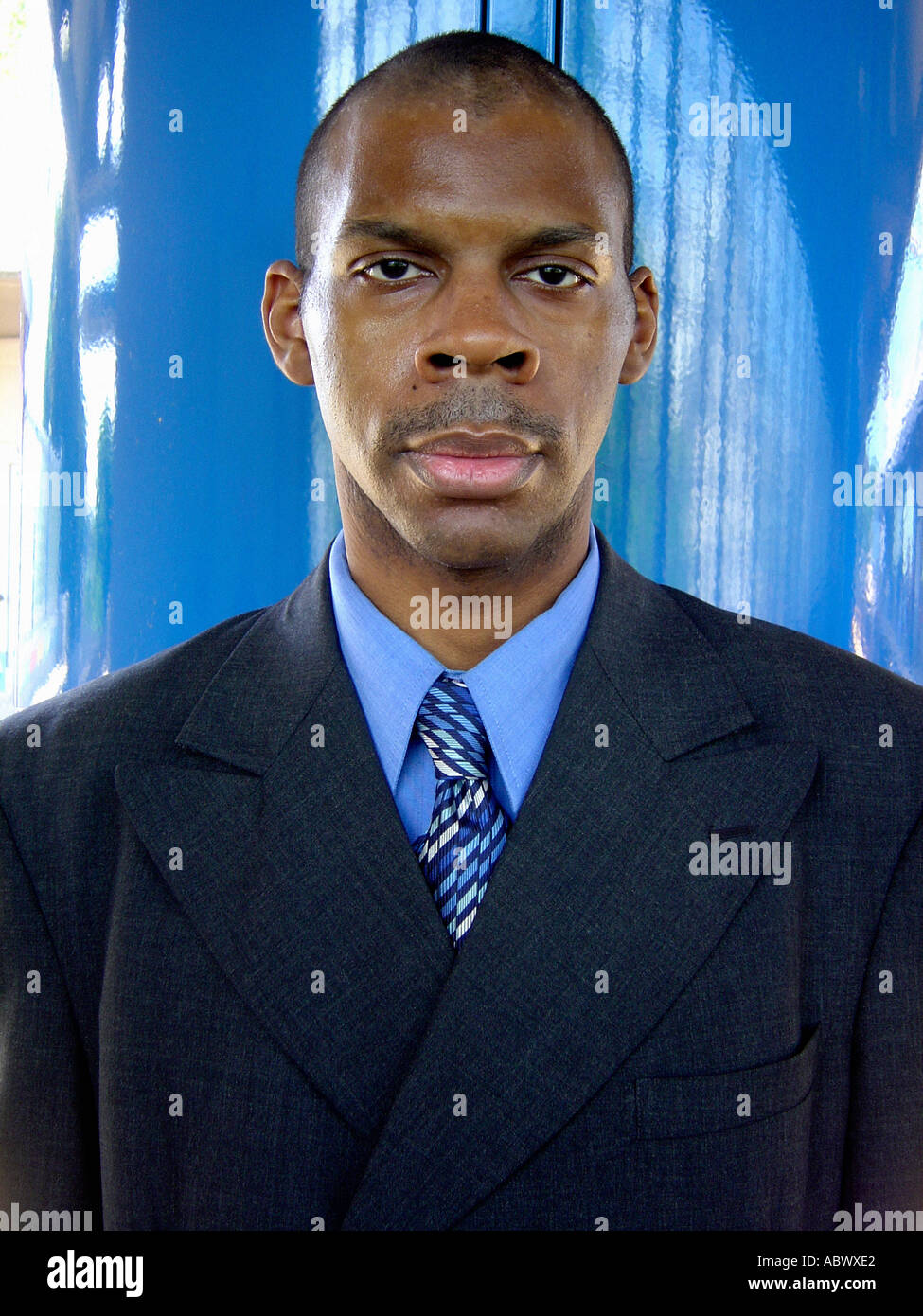 African American Business Man He is Wearing a Suit a Blue Shirt and a ...