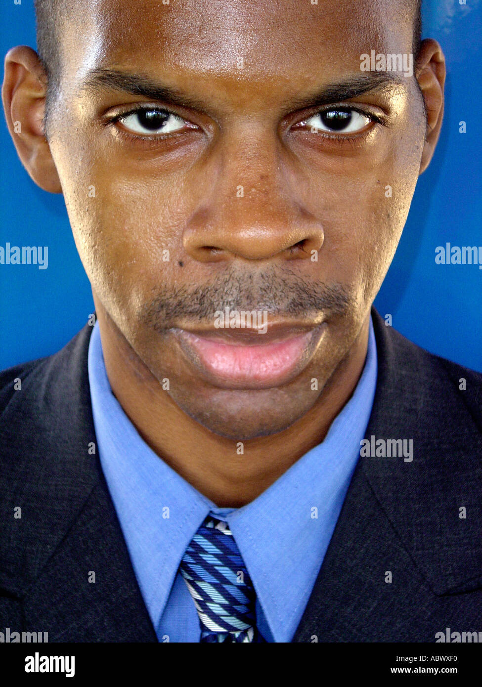 African American Business Man He is Wearing a Suit a Blue Shirt and a ...
