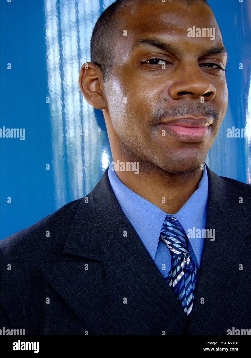 African American Business Man He is Wearing a Suit a Blue Shirt and a ...