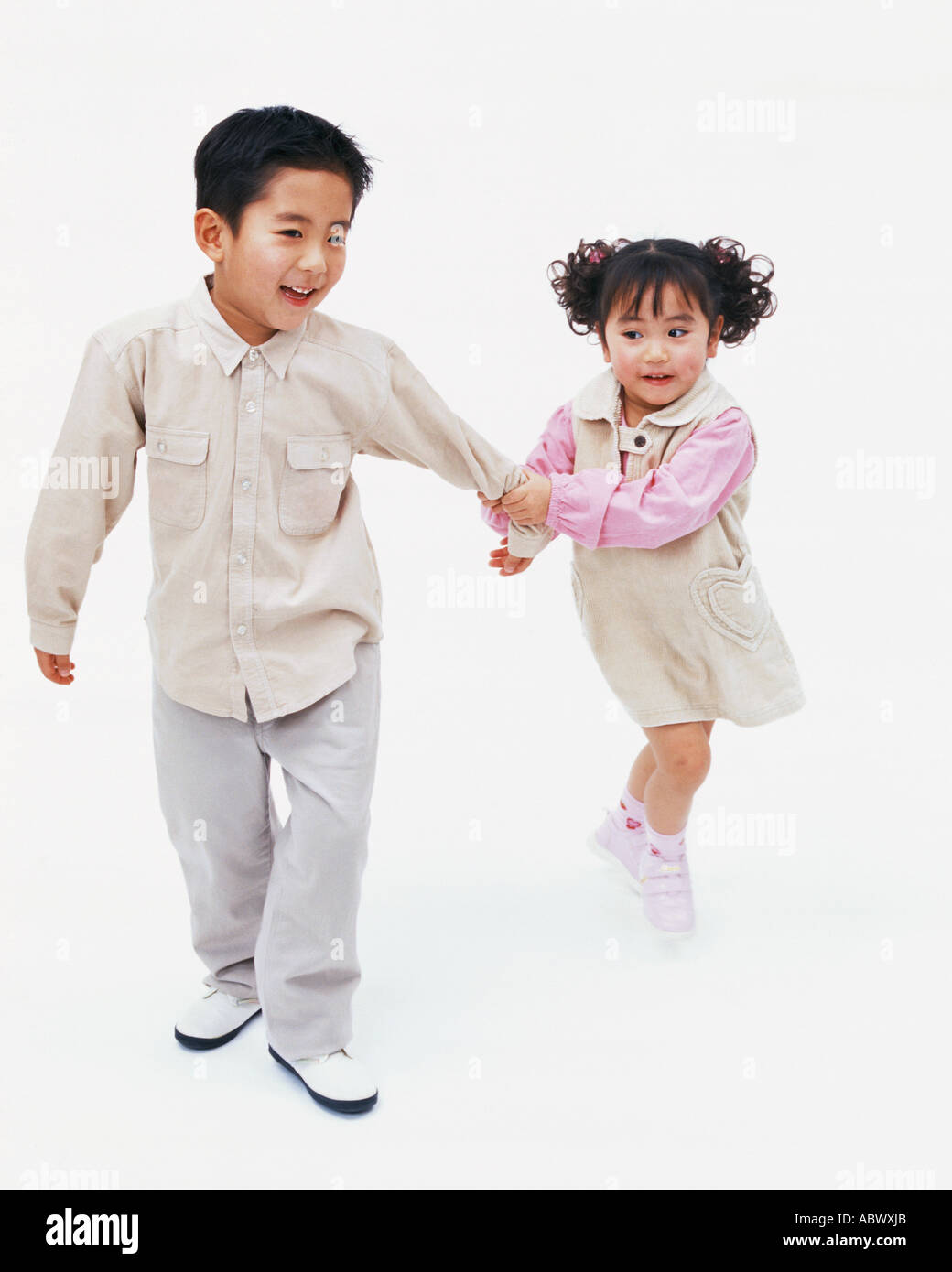 Brother sister holding hand walking hi-res stock photography and images ...