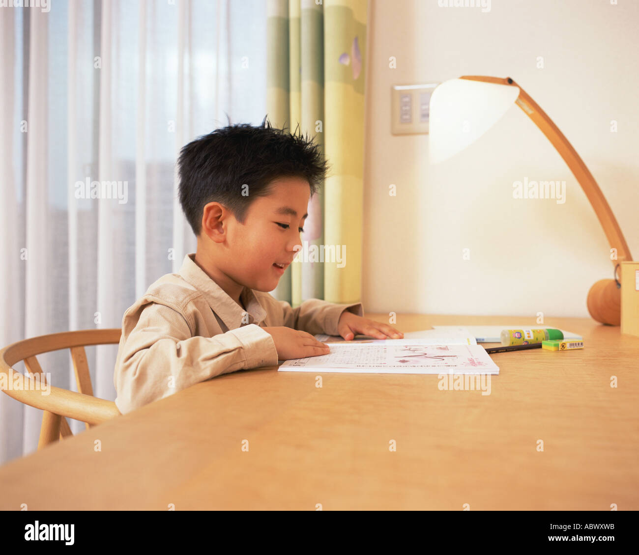 A boy doing homework asian hi-res stock photography and images - Alamy