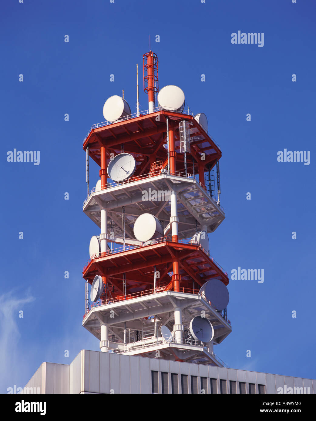 Low angle view of satellite dishes mounted on a tower Stock Photo - Alamy