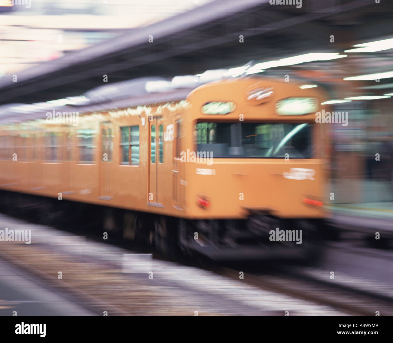 Side view of electric train at station Stock Photo - Alamy