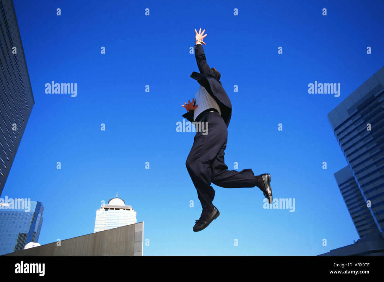 Person jumping in air office attire hi-res stock photography and images ...