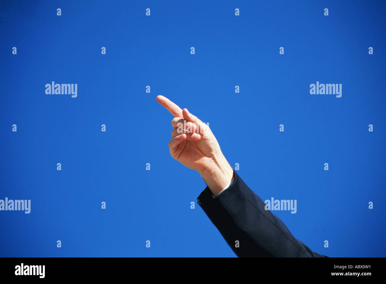 Finger pointing towards blue sky hi-res stock photography and images ...