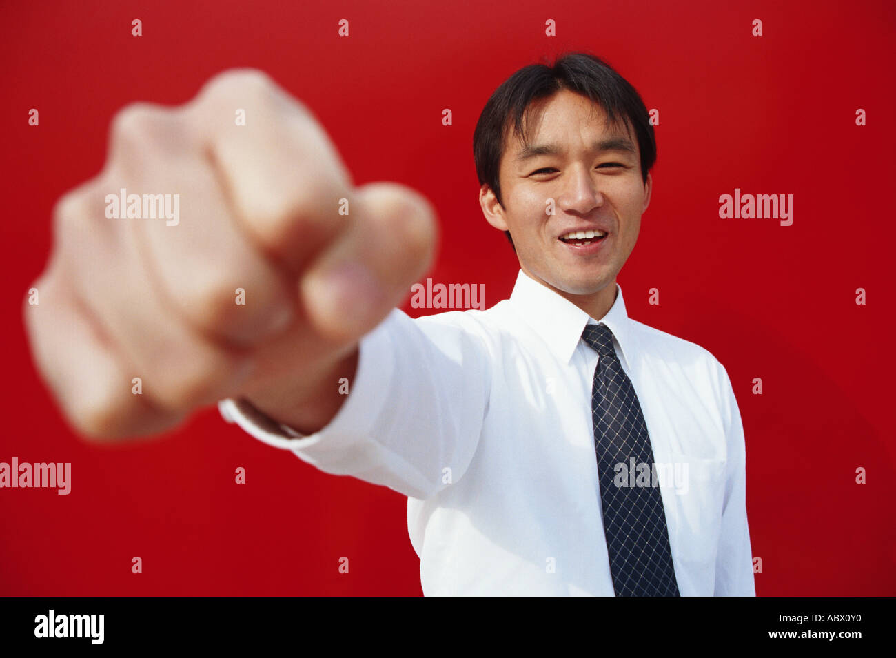 A man punching in front of a camera Stock Photo - Alamy