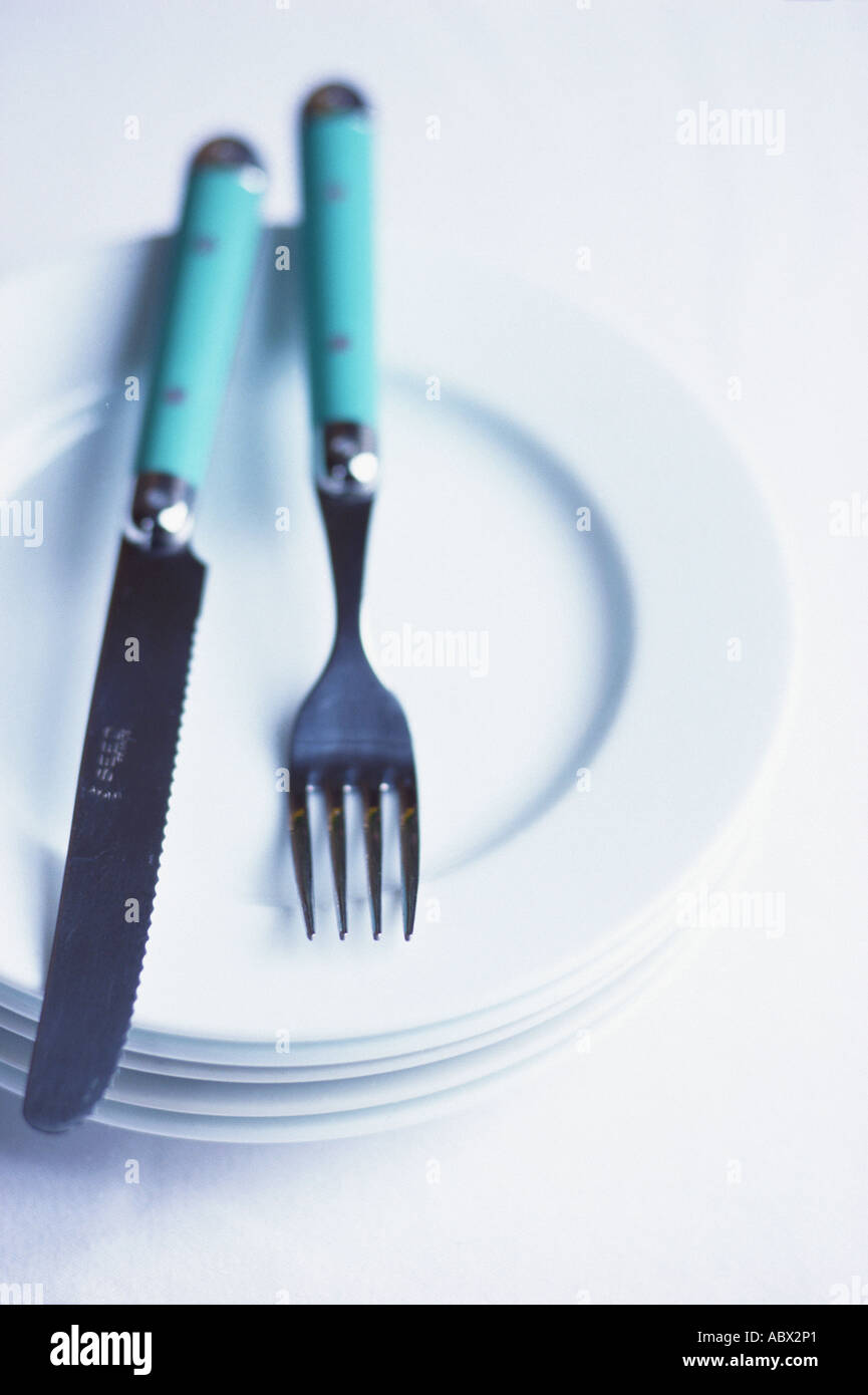 Cutlery on plate Stock Photo - Alamy