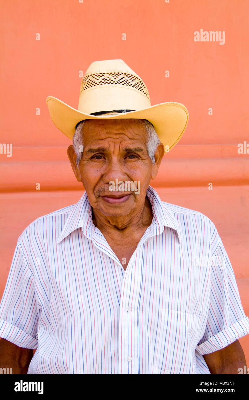 Local colorful man against bright wall with cowboy hat in tourist ...