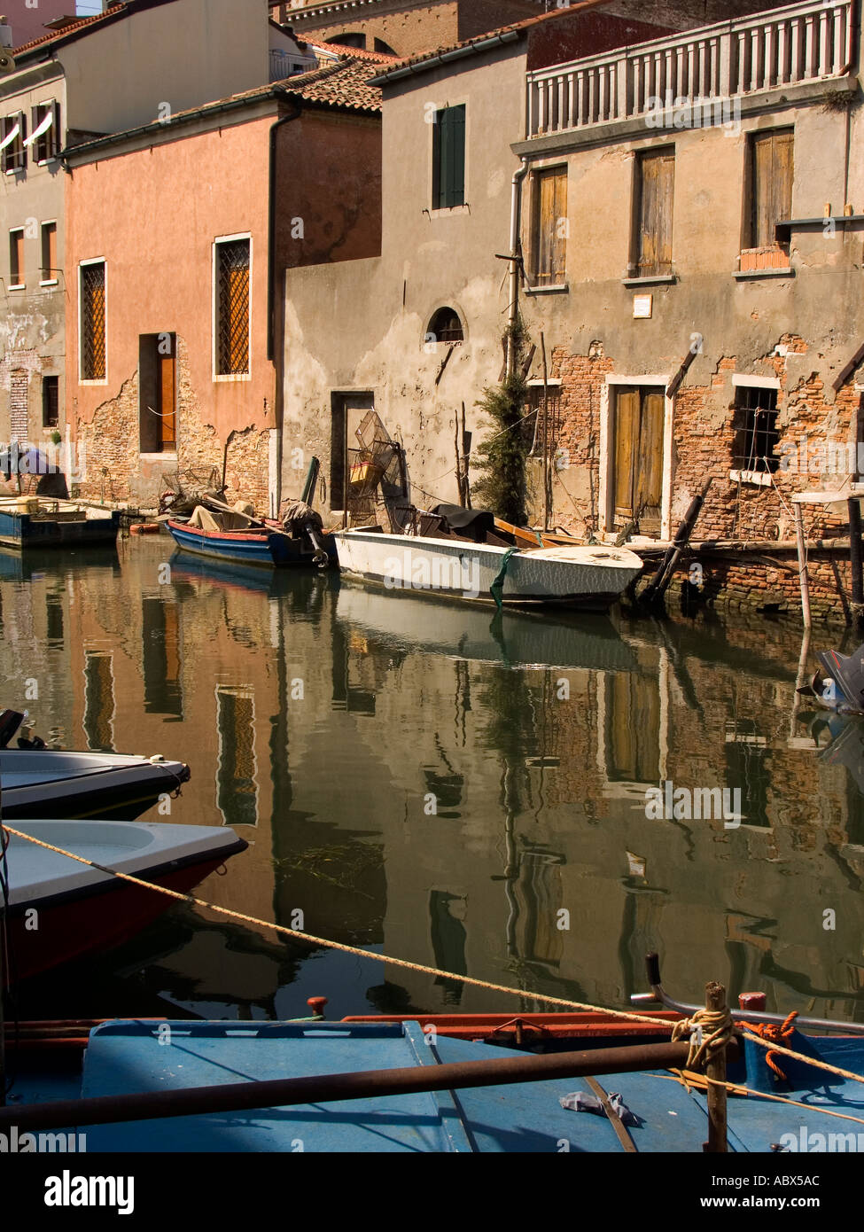 Calm water and reflections provide counterpoint to cast off junk filled ...