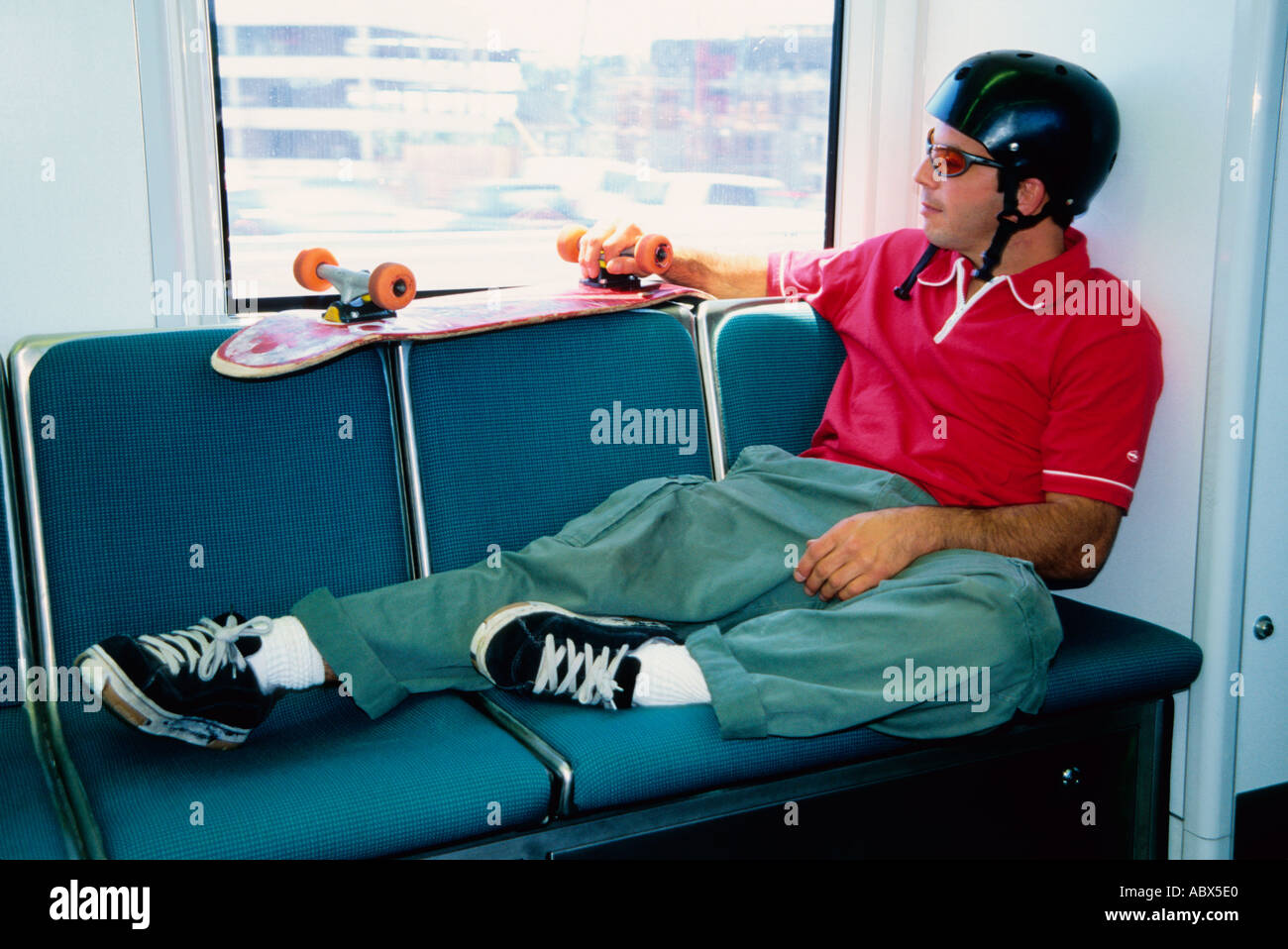 a young man on a commuter urban city metro train Stock Photo - Alamy