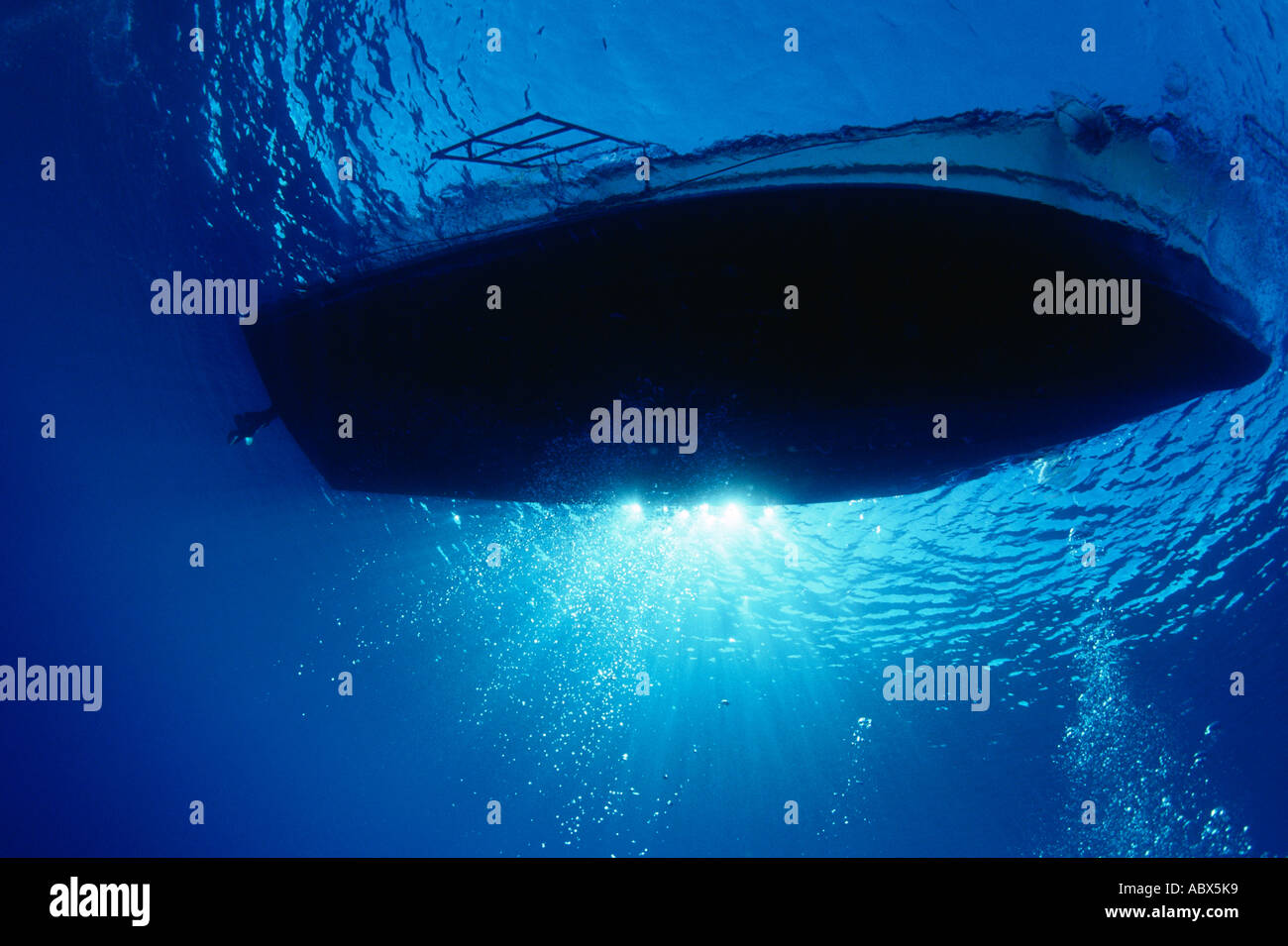Bottom of boat floating in ocean Stock Photo - Alamy