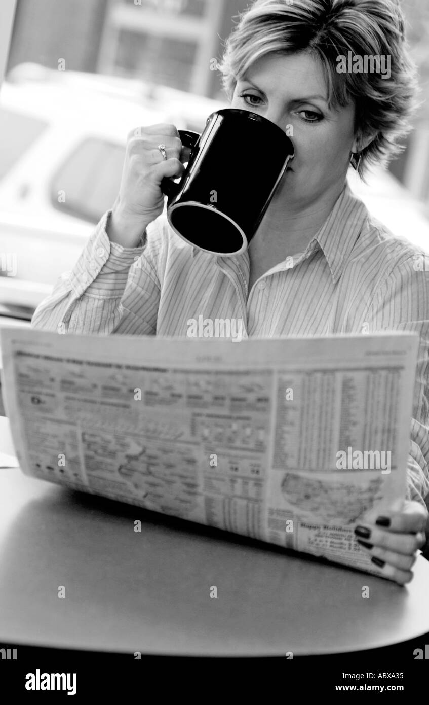 Woman reading information Black and White Stock Photos & Images - Alamy