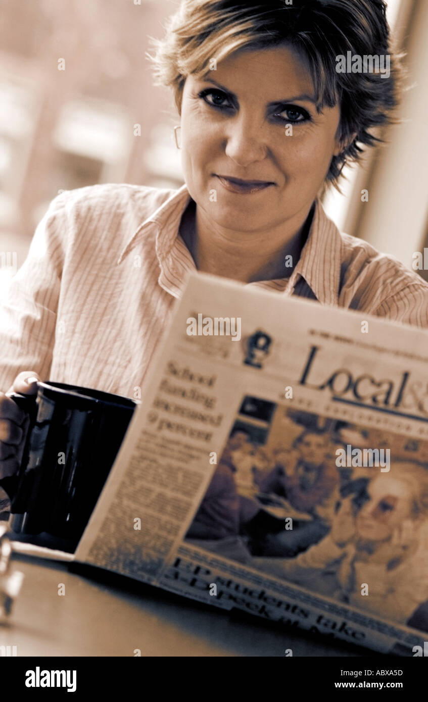 Person reading metro newspaper hi-res stock photography and images - Alamy