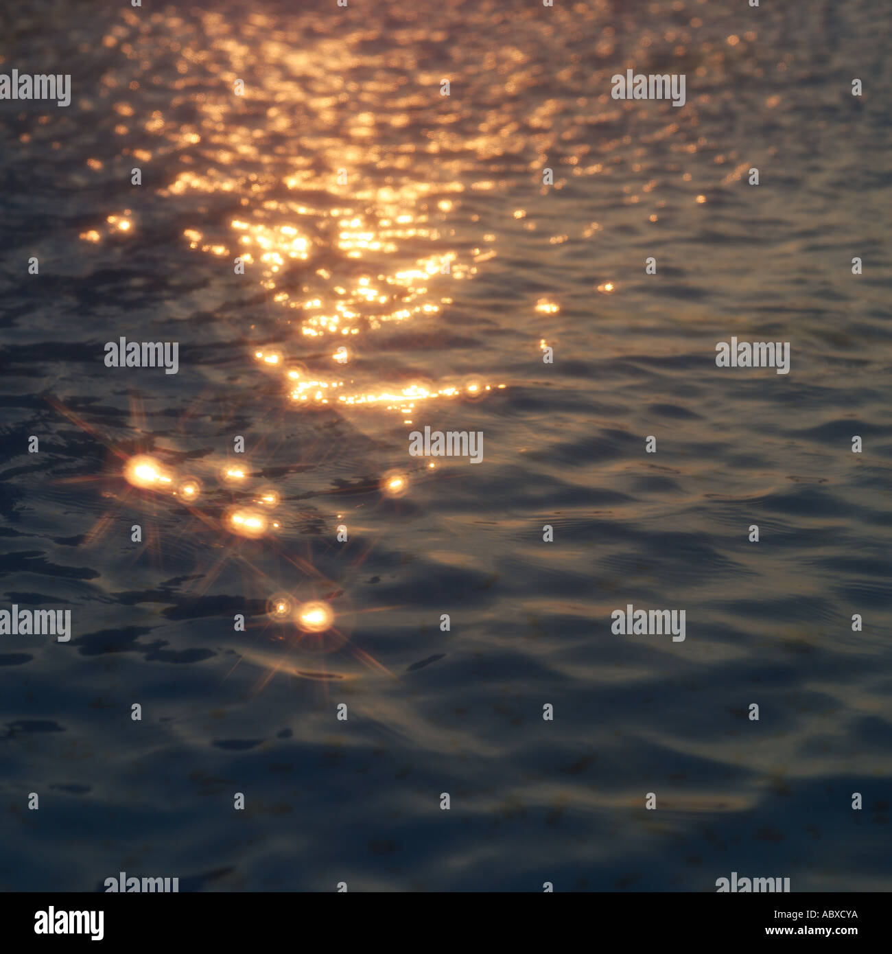 Sunlight reflected on water surface Stock Photo - Alamy