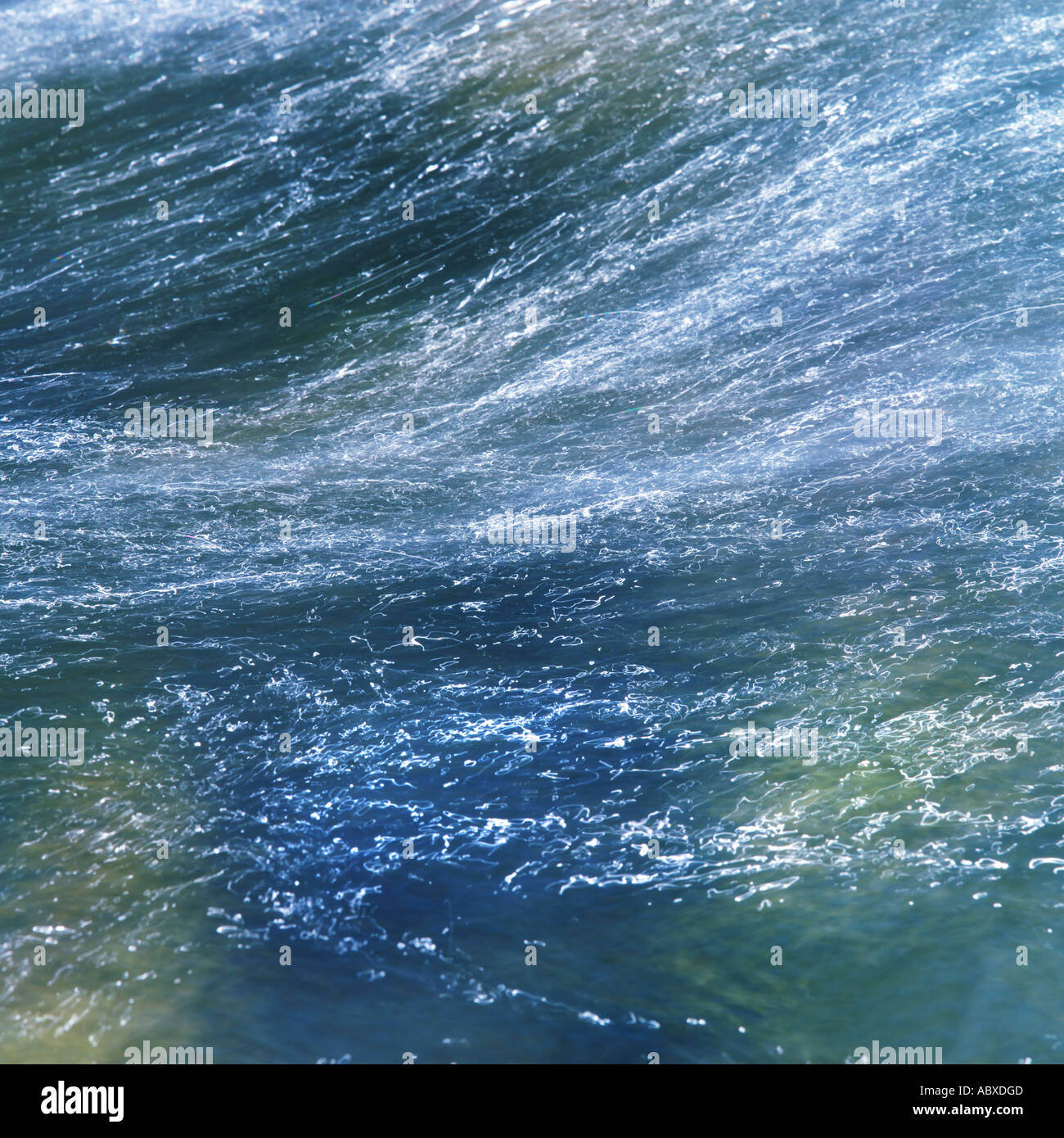 Water flowing rapidly in stream Stock Photo - Alamy