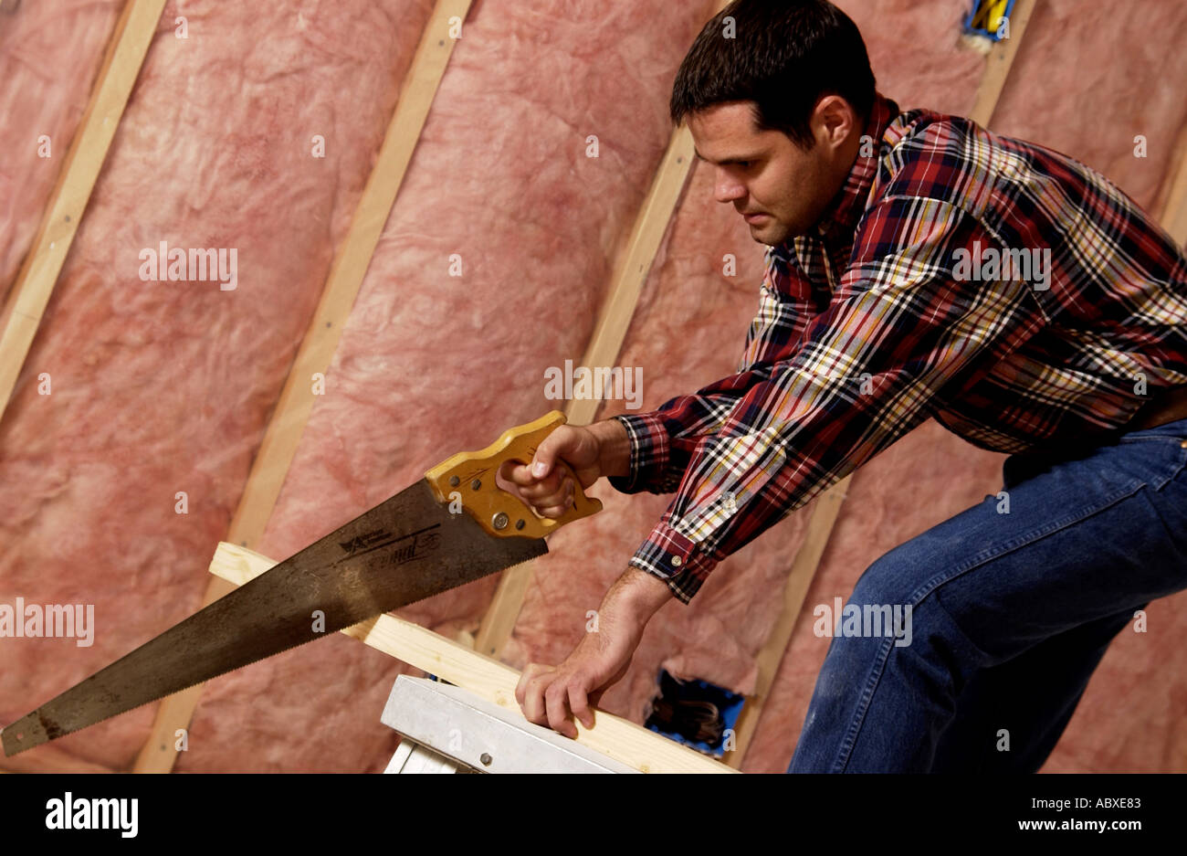 Man cutting lumber Stock Photo - Alamy