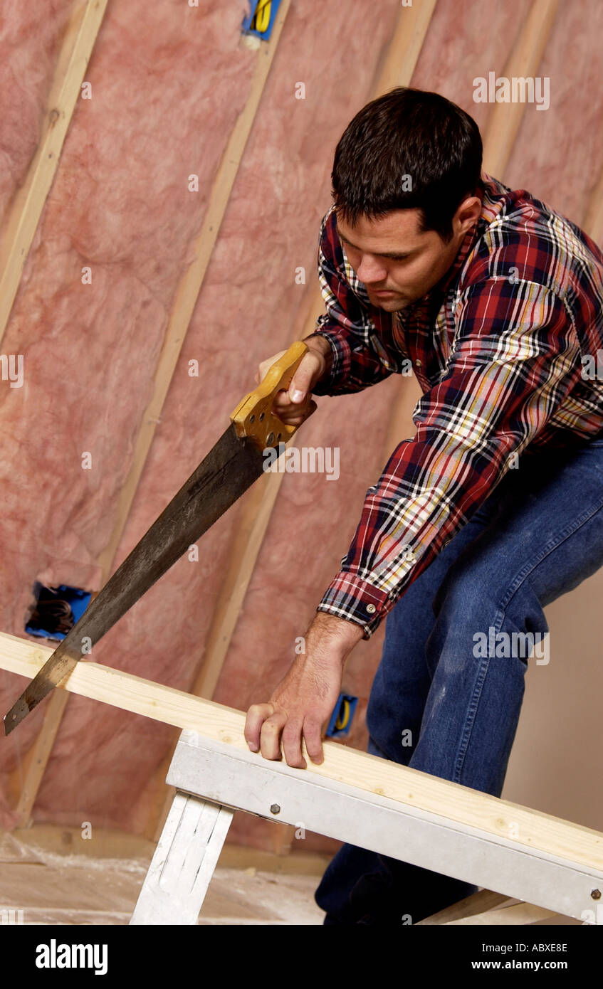 Man cutting lumber Stock Photo - Alamy