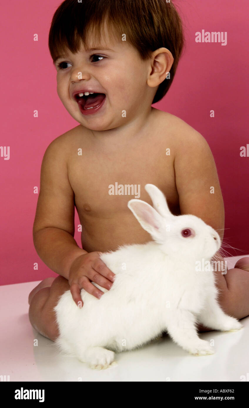 Boy with white rabbit Stock Photo - Alamy
