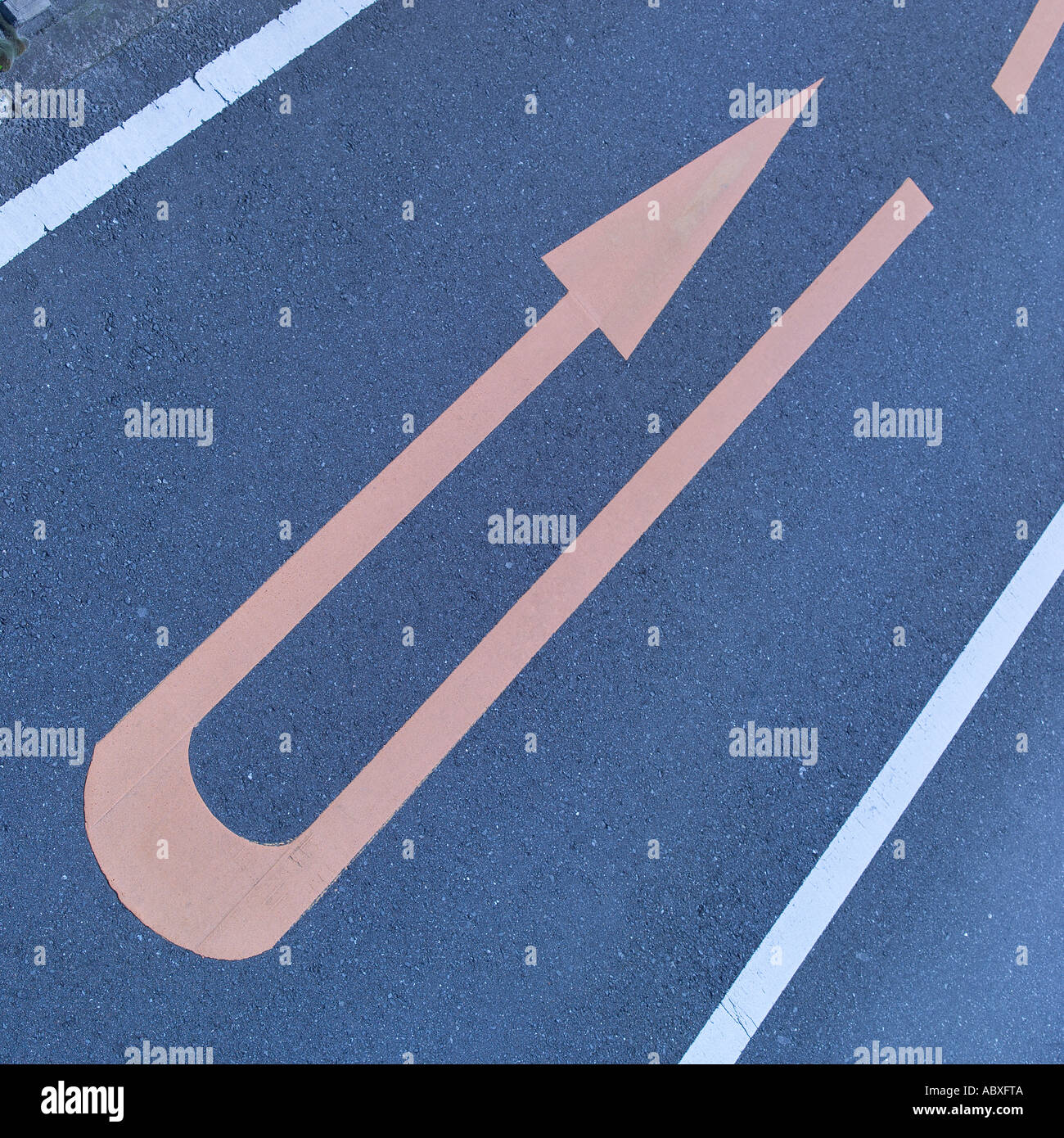 Arrow sign on road Stock Photo - Alamy