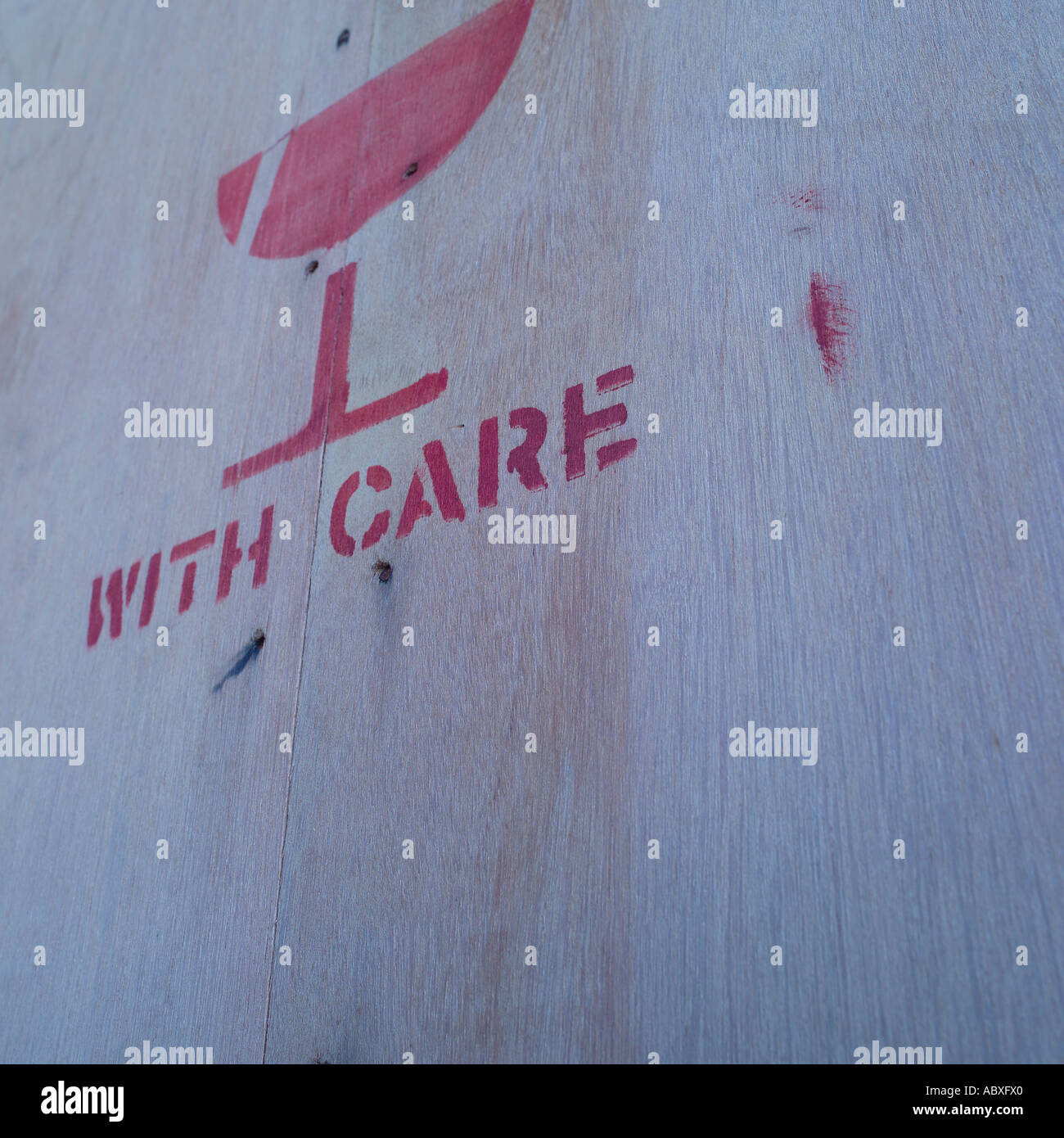 Wooden crate with handle with care mark Stock Photo - Alamy