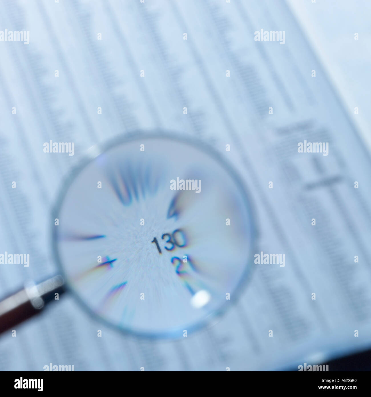 Magnifying glass on newspaper Stock Photo - Alamy