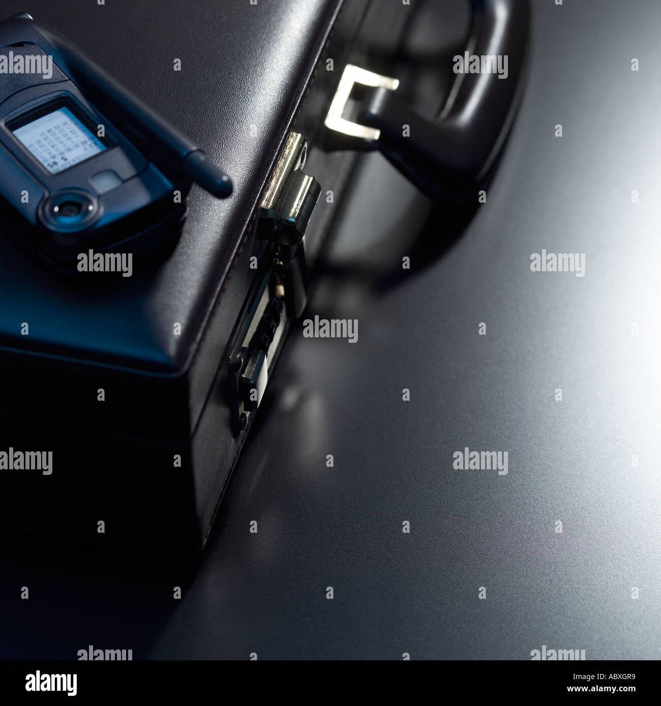 Mobile phone on briefcase Stock Photo - Alamy