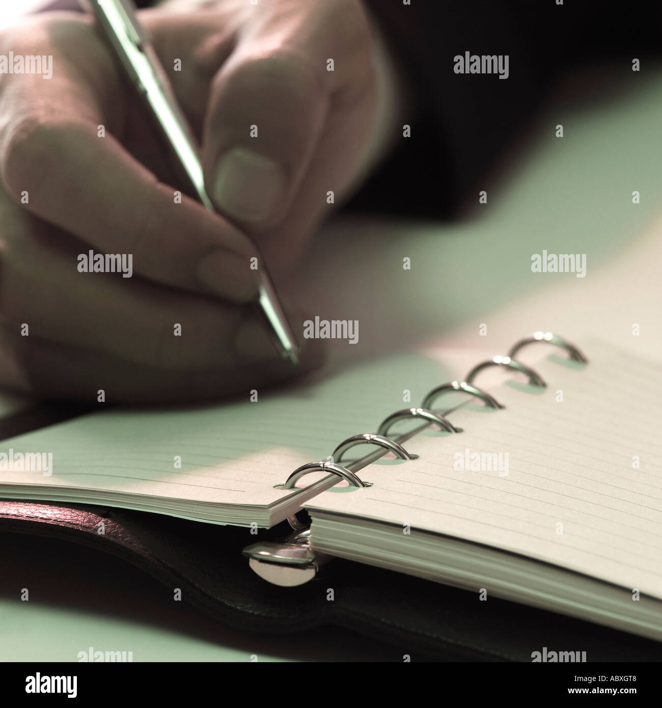 Mid adult man writing hi-res stock photography and images - Alamy