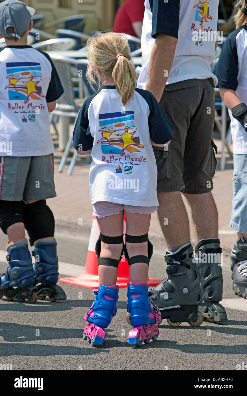 kids roller blading on street with protection Stock Photo - Alamy